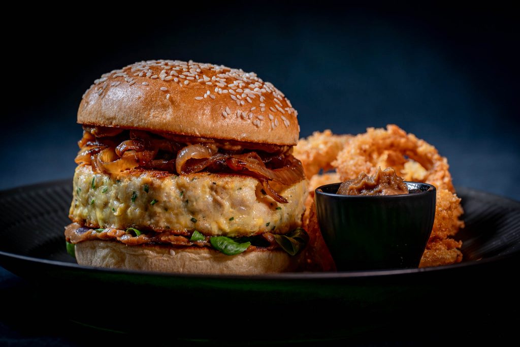 Norwegian pollock burger with caramelized onions & onion rings - SY Selkie