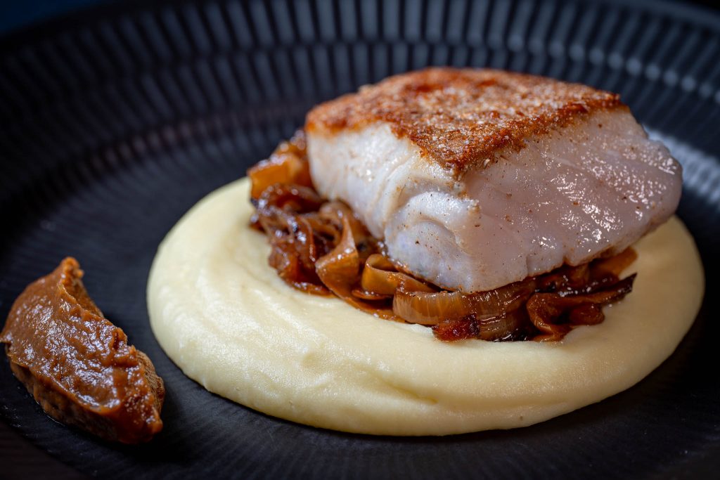 Gourmet Norwegian Seibiff pollock steak with caramelized onions - SY Selkie